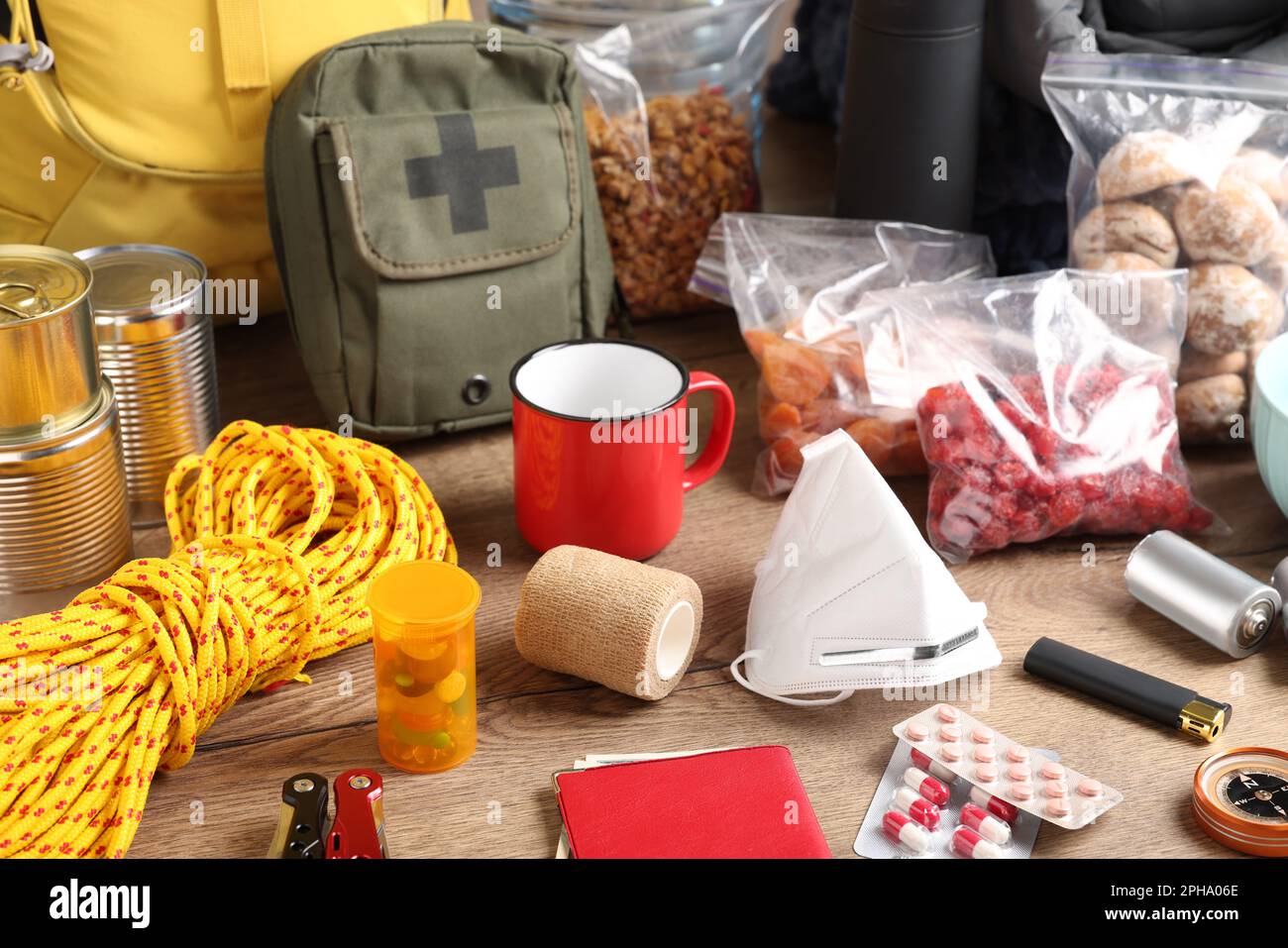 Disaster supply kit for earthquake on wooden table Stock Photo - Alamy