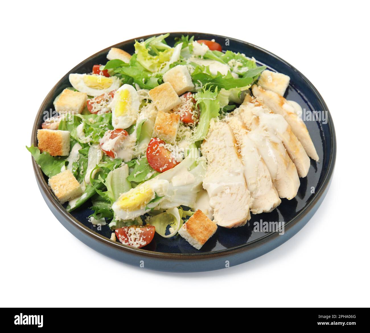 Delicious Caesar salad in bowl isolated on white Stock Photo - Alamy