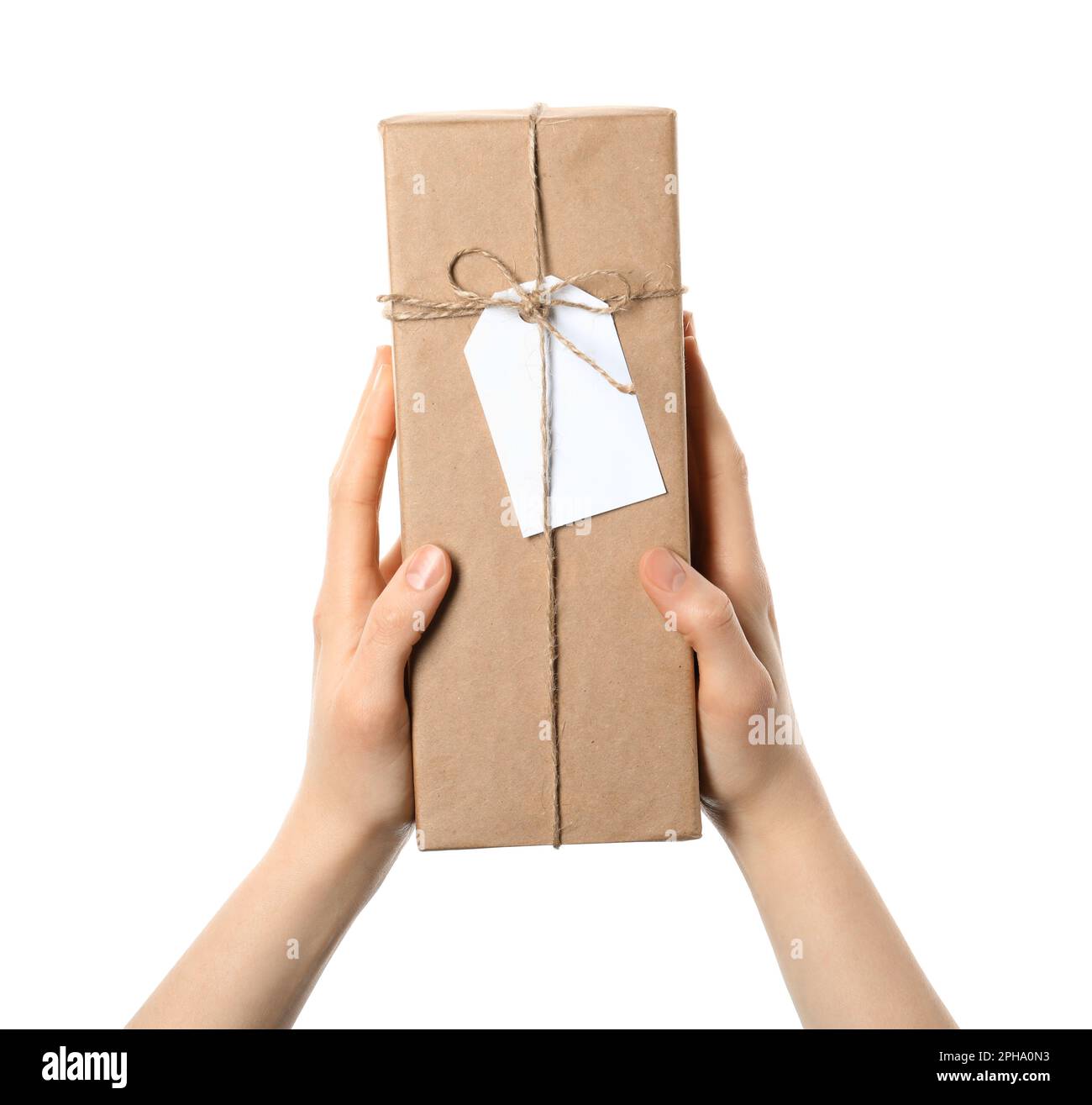 Woman holding parcel wrapped in kraft paper with tag on white ...