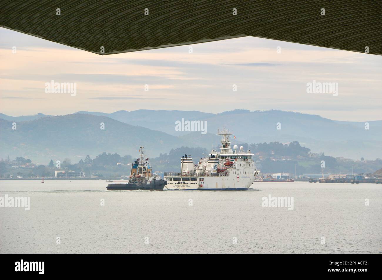 Juan de la Cosa hospital ship coming into the port with tug ...