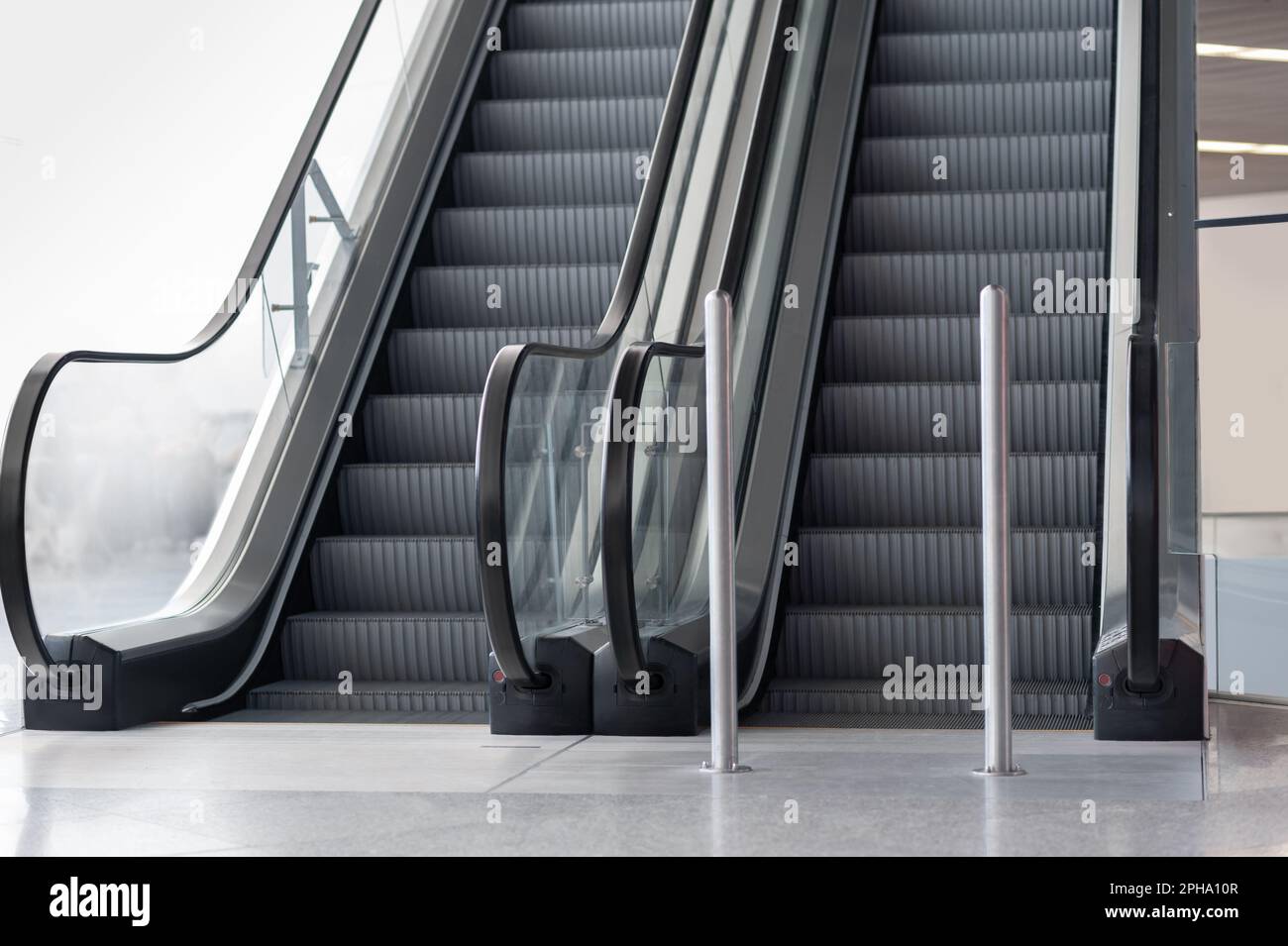 Interior of new airport terminal with escalators Stock Photo - Alamy