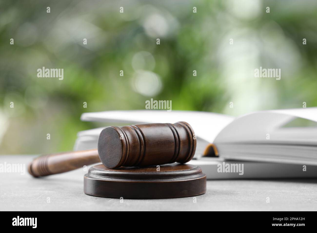 Wooden gavel on grey table against blurred background Stock Photo - Alamy