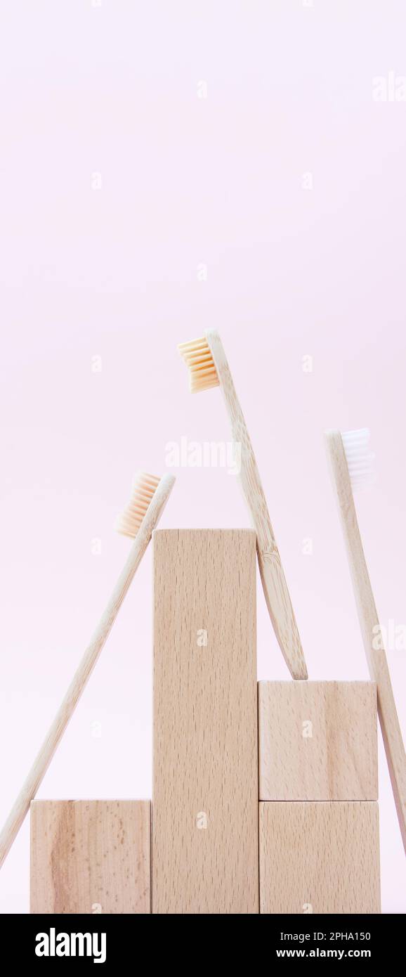 Composition of bamboo toothbrushes and wooden podium blocks. The ...