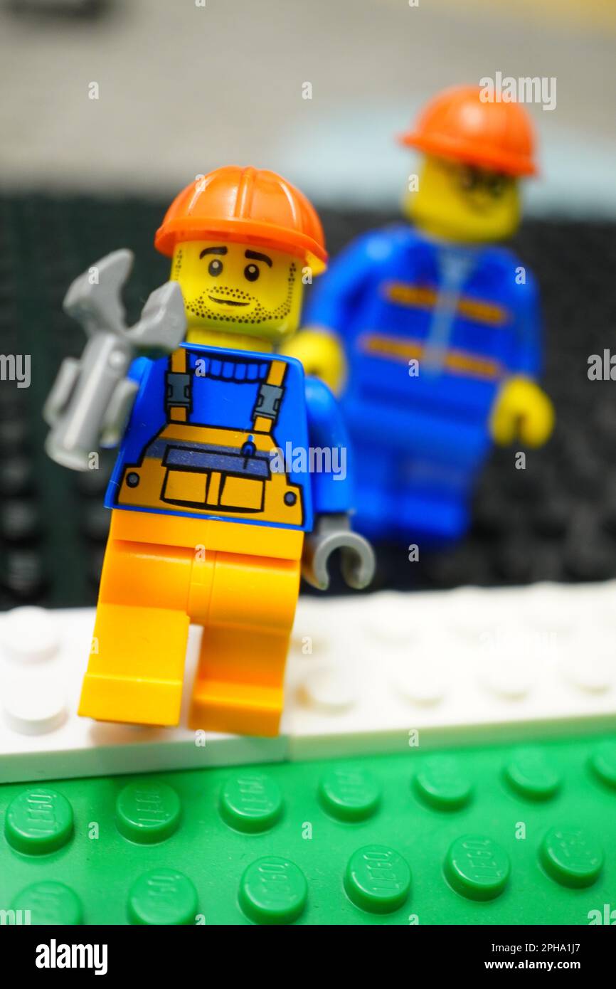 A close-up of a miniature Lego construction worker figurine from a Lego ...