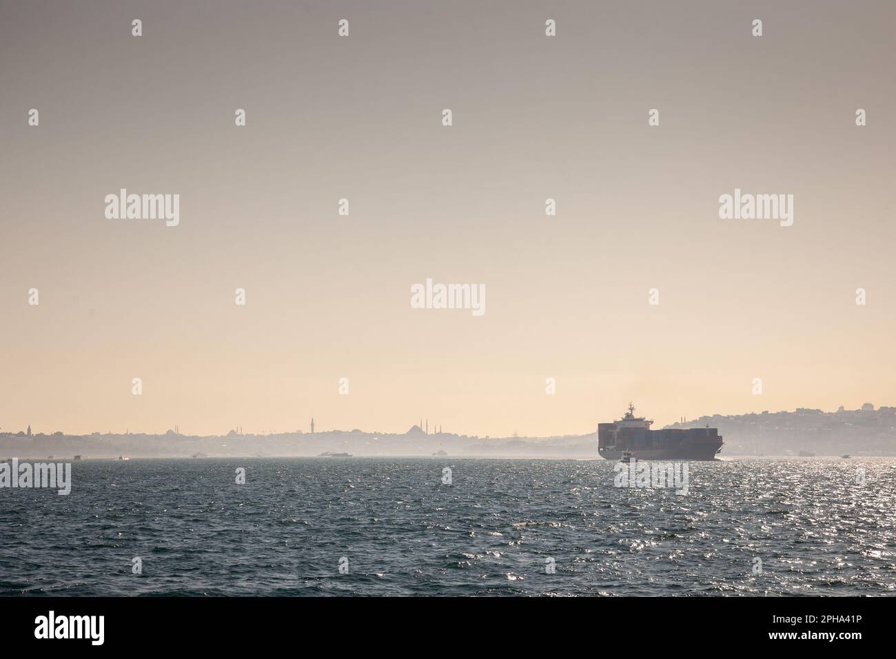 Picture of an cargo ship carrying containers cruising on the bosporus ...