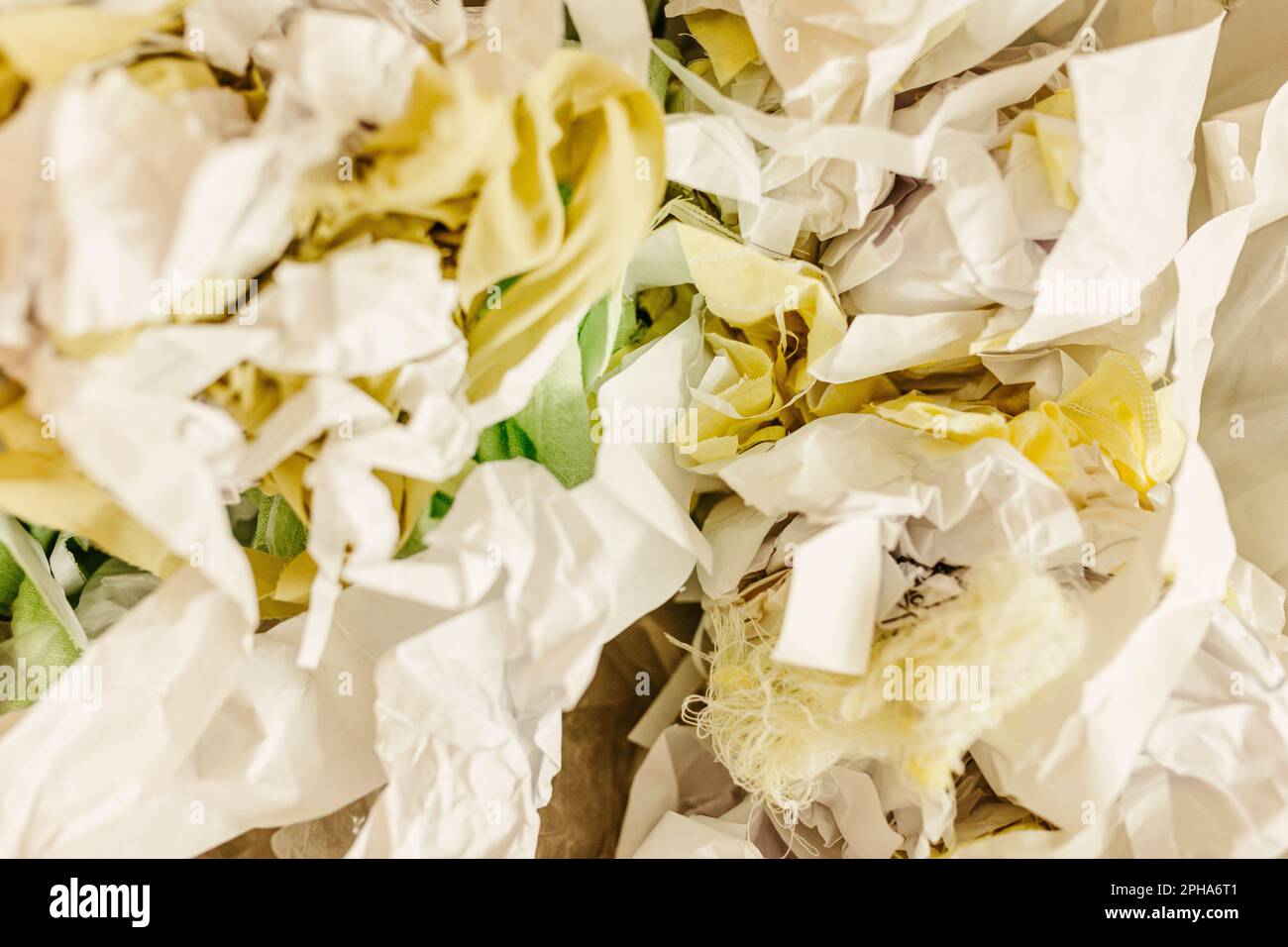 A high-resolution closeup photo of a stack of crumpled white paper ...
