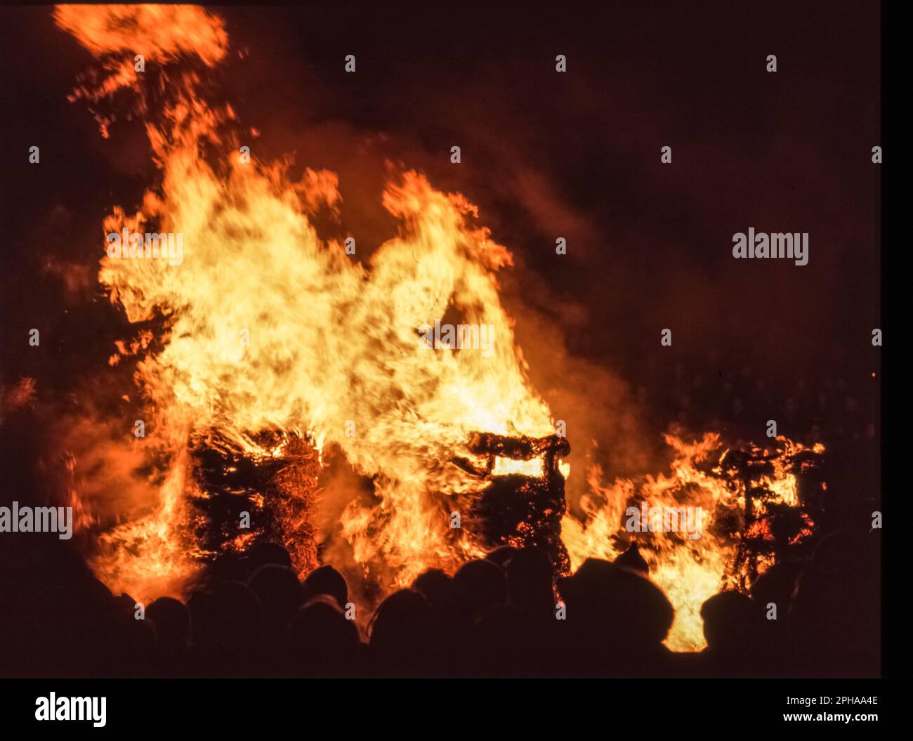 A crowd watching bonfire at night Stock Photo - Alamy