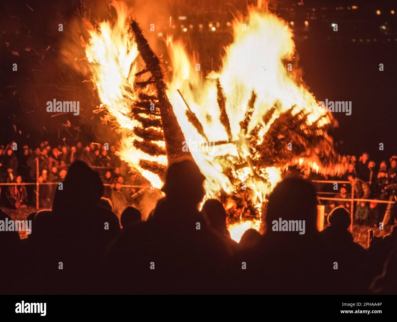 A crowd watching bonfire at night Stock Photo - Alamy