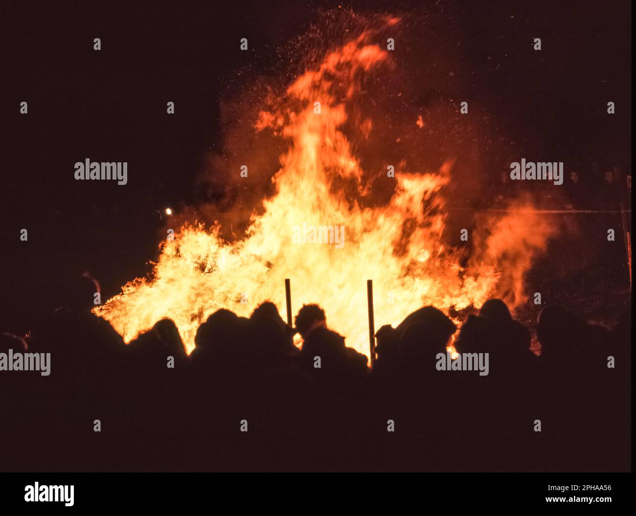 A crowd watching bonfire at night Stock Photo - Alamy
