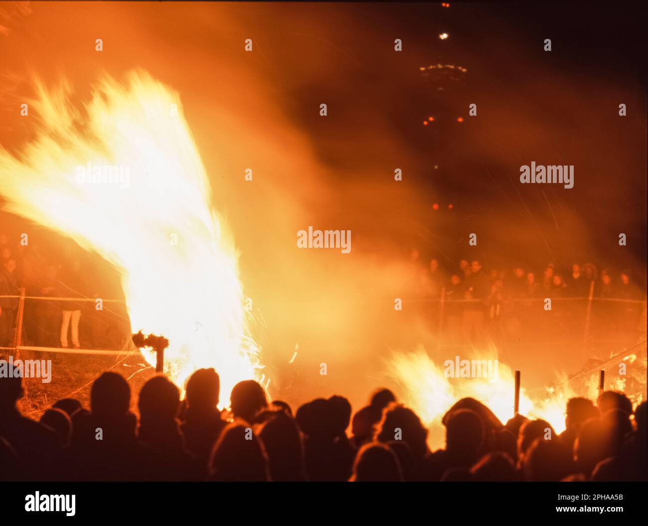 A crowd watching bonfire at night Stock Photo - Alamy