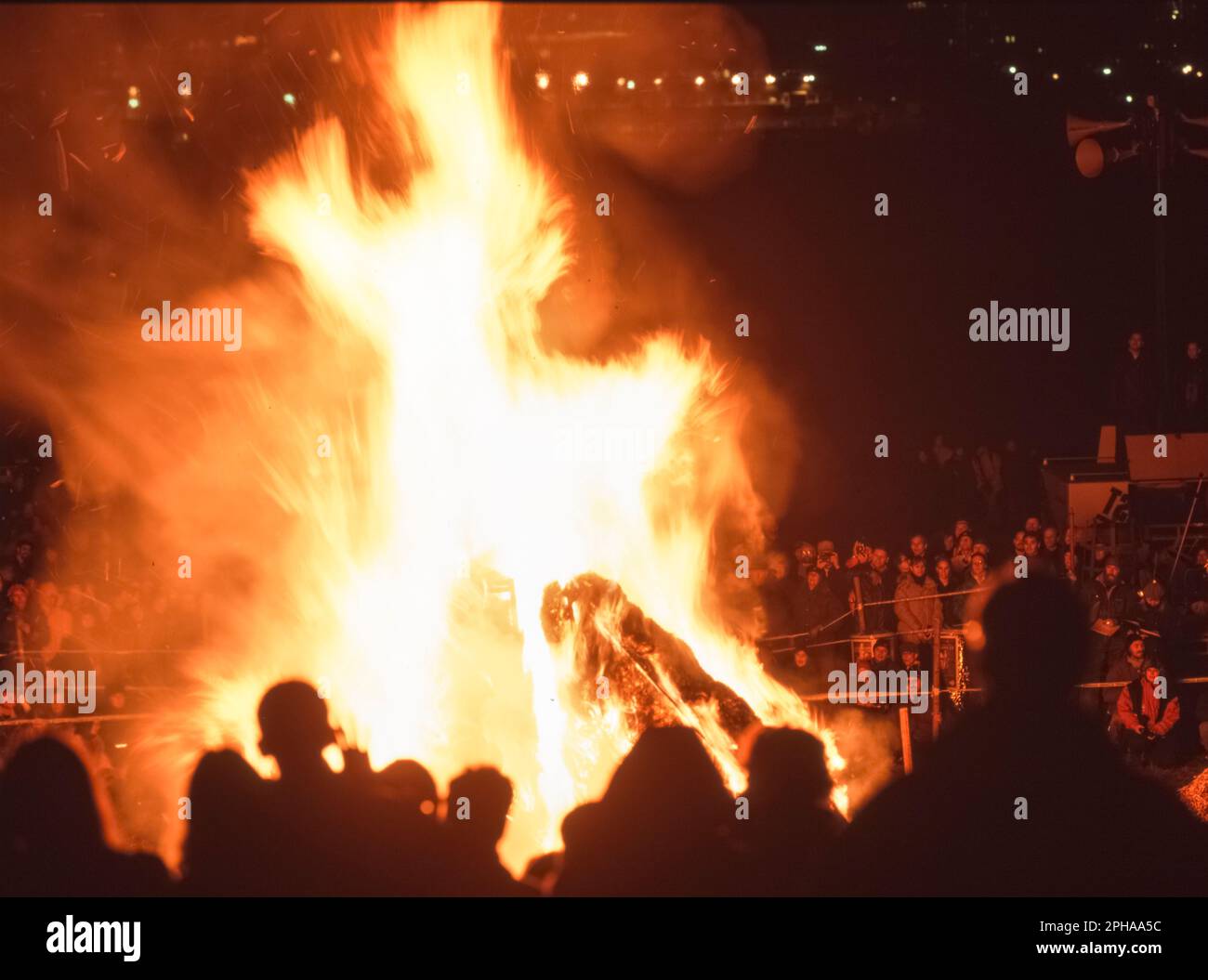 A crowd watching bonfire at night Stock Photo - Alamy