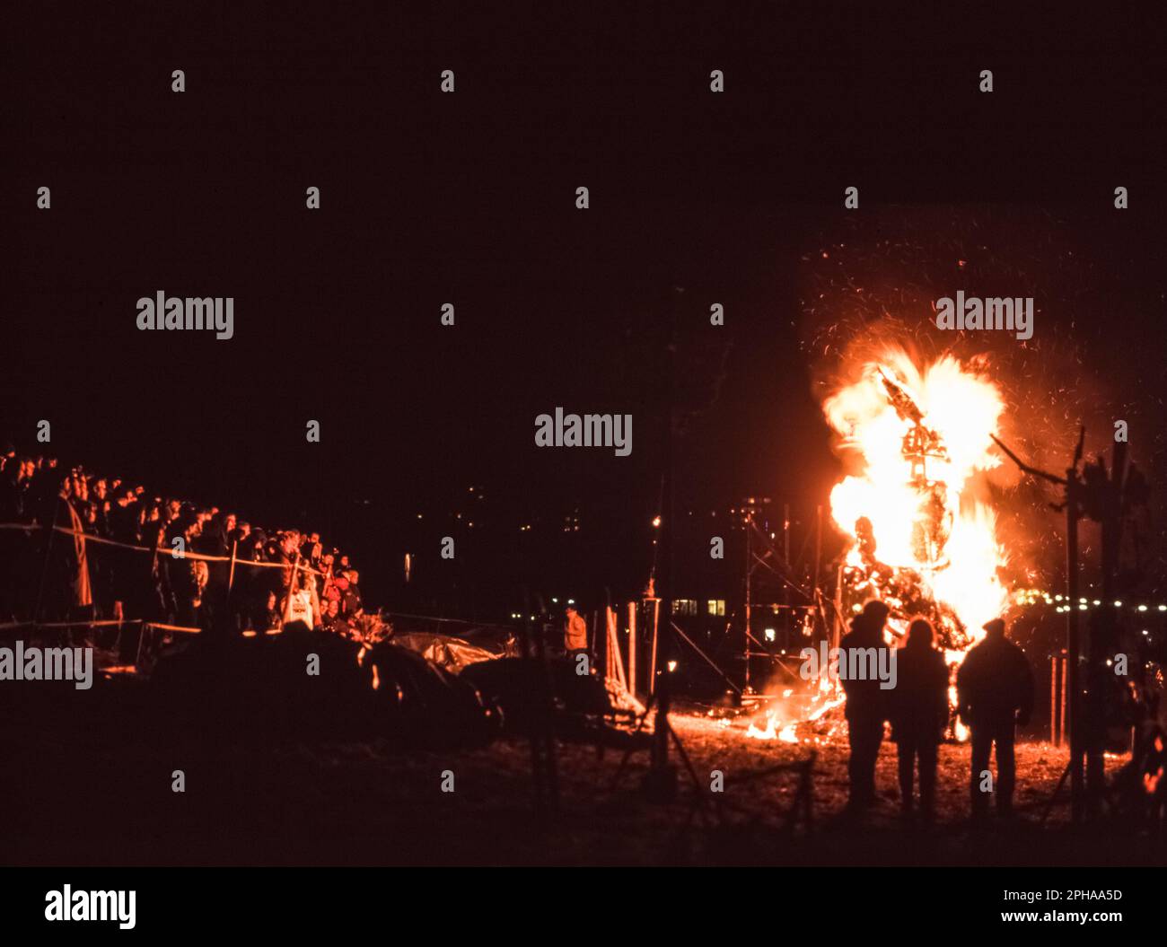 A crowd watching bonfire at night Stock Photo - Alamy