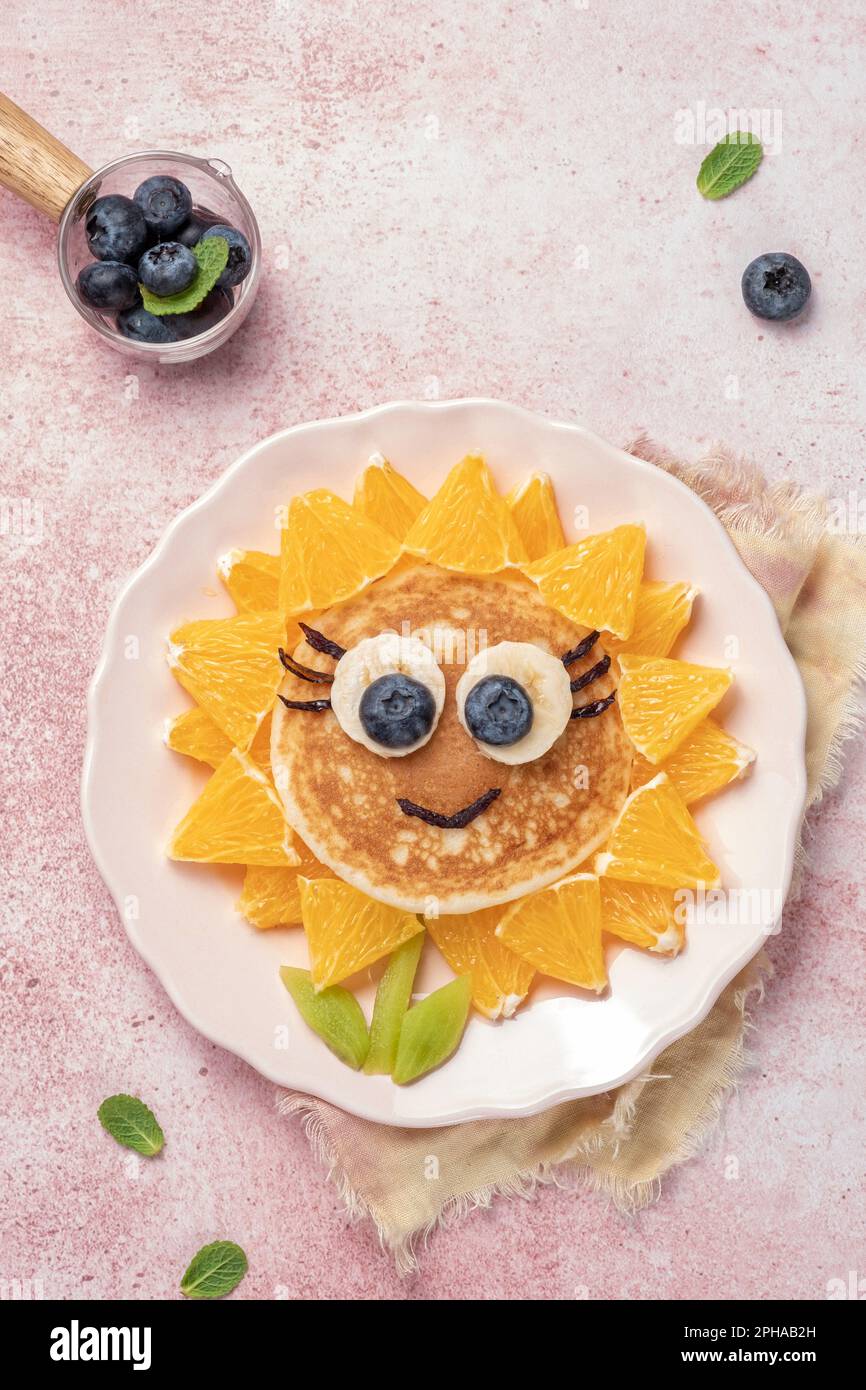 Funny Flower Pancake with berries for kids Stock Photo - Alamy