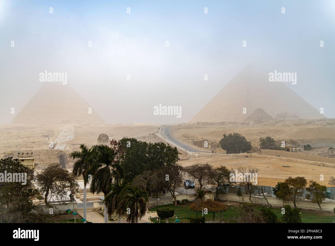 A hazy view of the Pyramids of Giza complex from a hotel in Egypt Stock ...