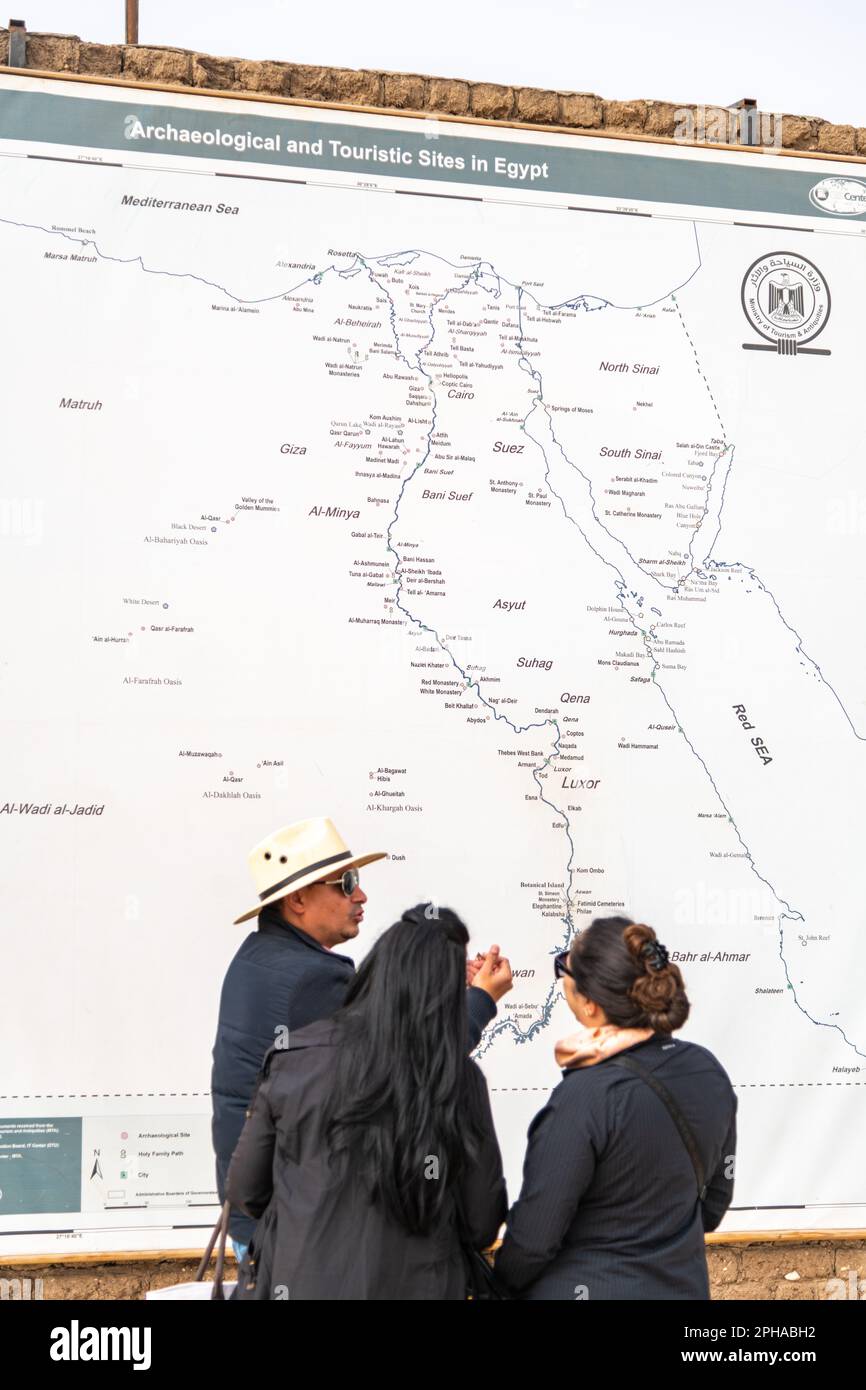 A tour guide explaining the archaeological sites of Egypt at the ...