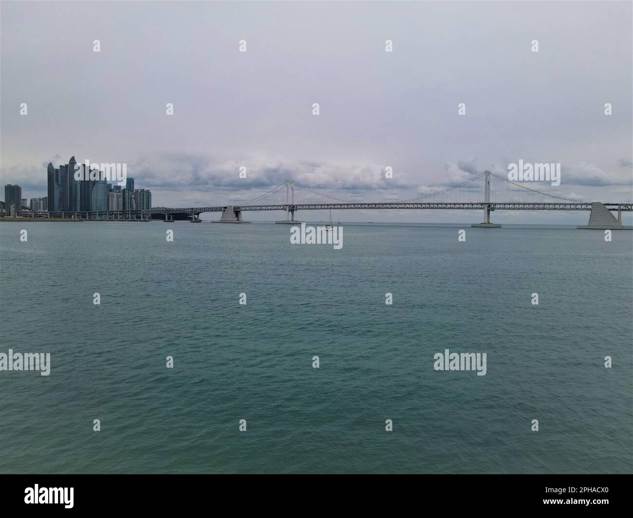 An aerial view of the Busan skyline with the Gwangan Bridge crossing ...