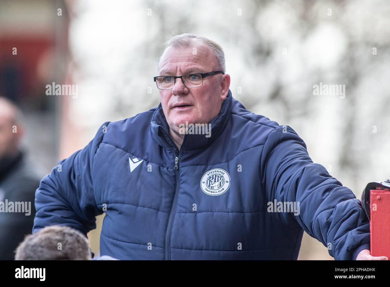 Football manager Steve Evans standing on touchline during game whilst ...