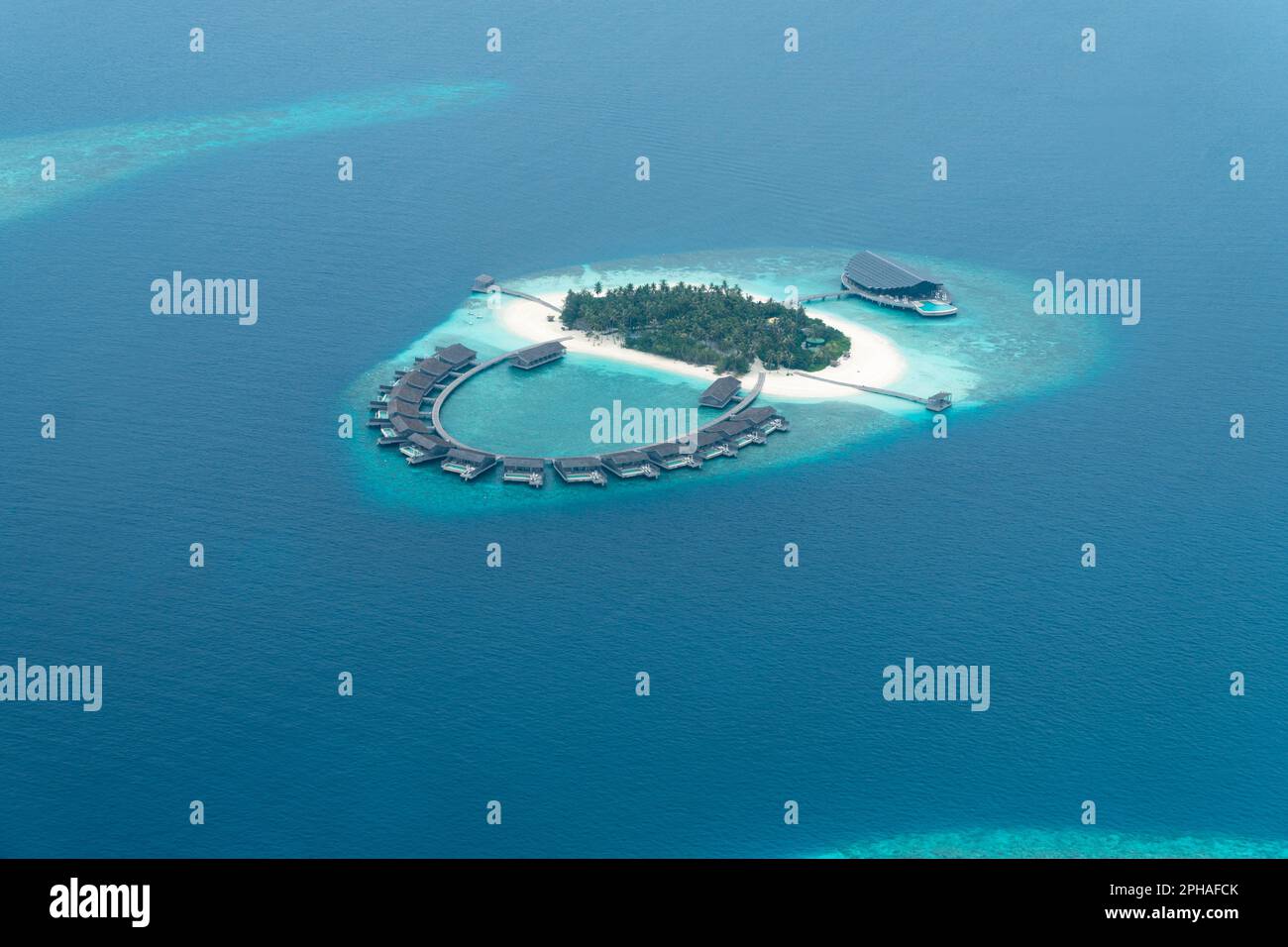 beautiful aerial view of a remote tropical island resort in one of the ...