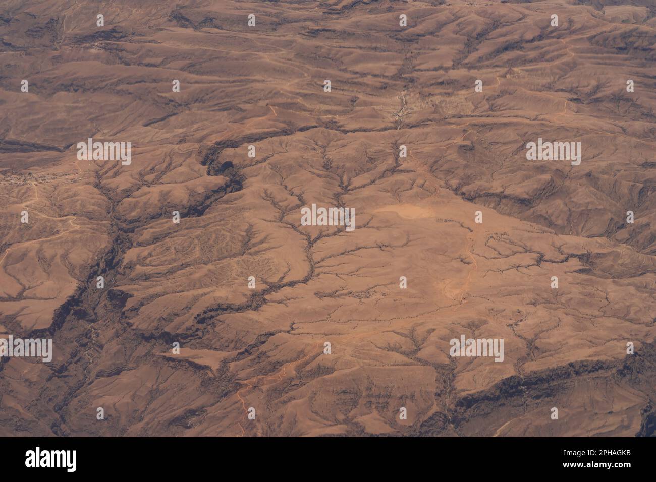 dramatic aerial view of the texture and patterns on the barren desert ...