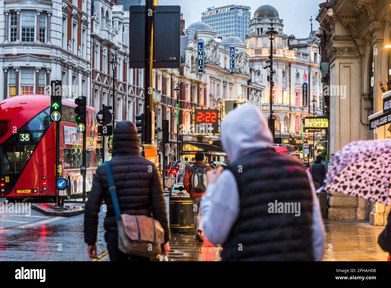 People walking in rain in Shaftesbury Avenue, a famous street in the ...