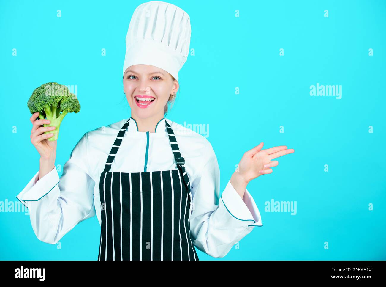 Girl hold vegetable. Organic nutrition. Woman chef hold broccoli ...