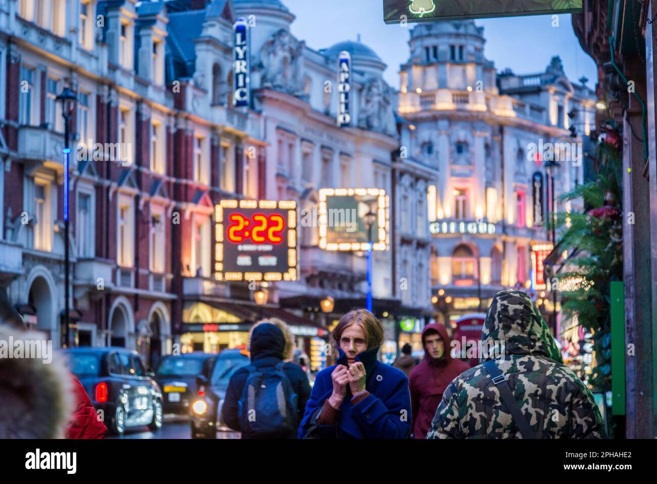 People walking in rain in Shaftesbury Avenue, a famous street in the ...