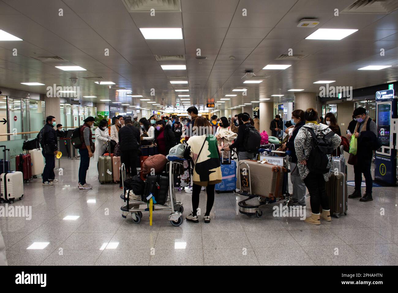 Korean people and foreign travelers passengers walking carry luggage ...