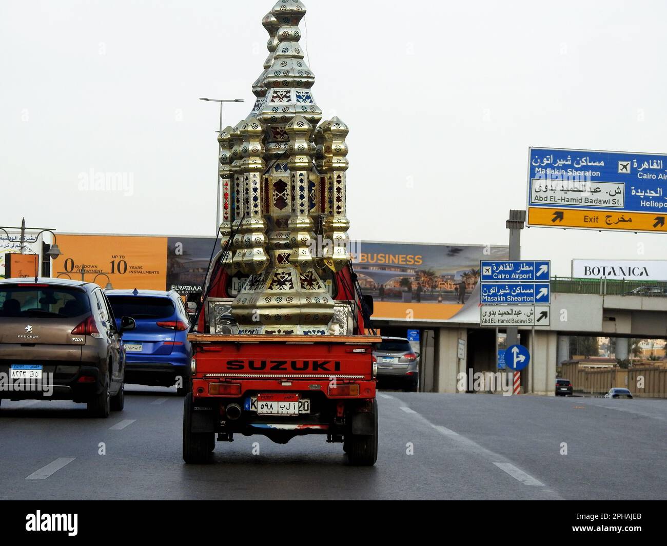 Cairo, Egypt, March 23 2023: A car transporting large Fanous lantern Islamic lamp of Ramadan to ...