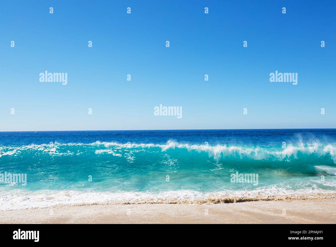 Blue wave on the beach. Dramatic natural background Stock Photo - Alamy