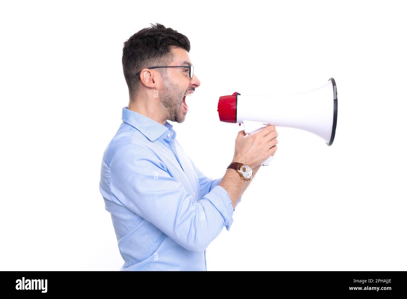profile of man announcer with megaphone in studio. shouting man ...