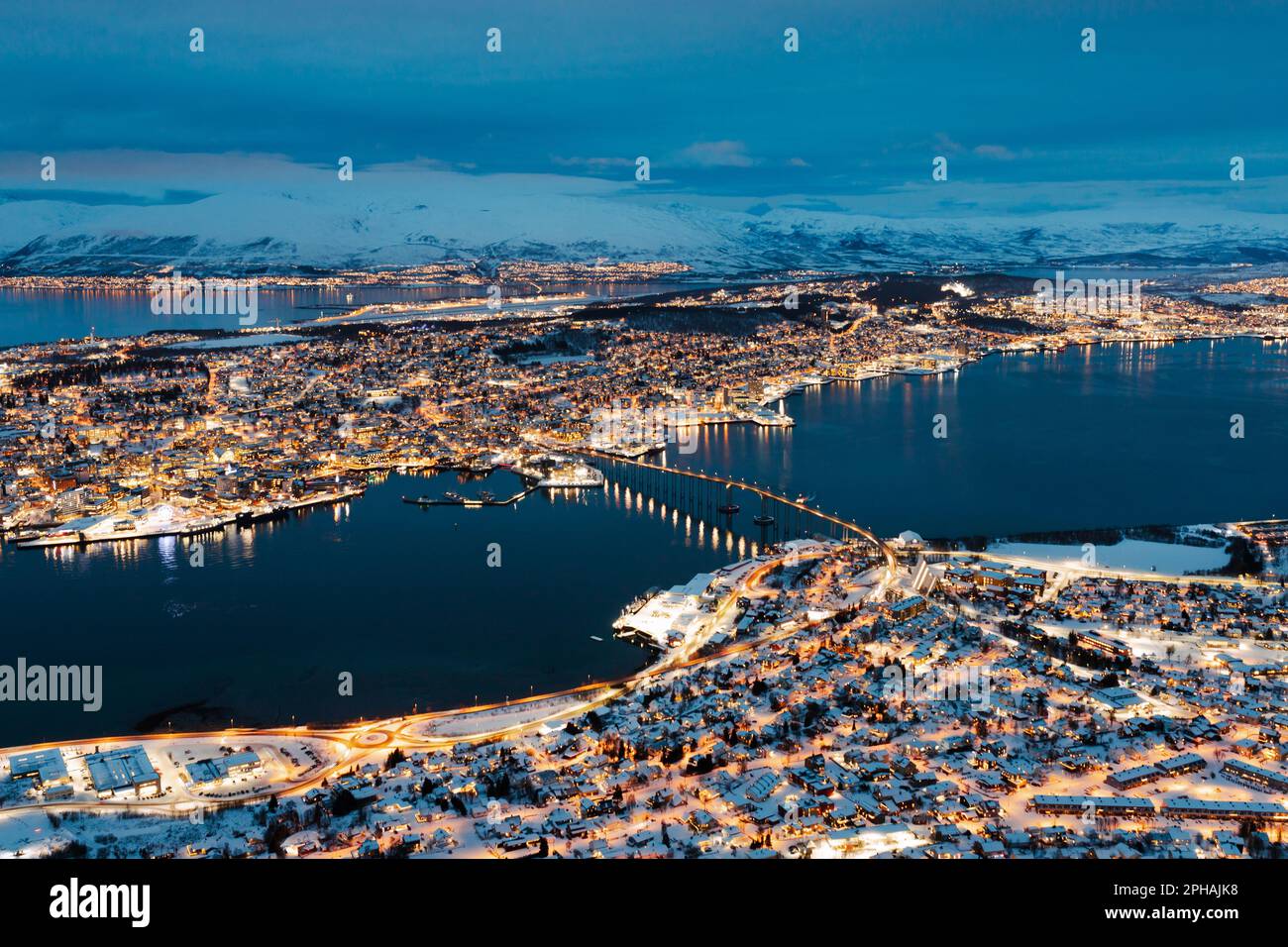 An aerial view of the city of Troms, Norway, illuminated by the night ...