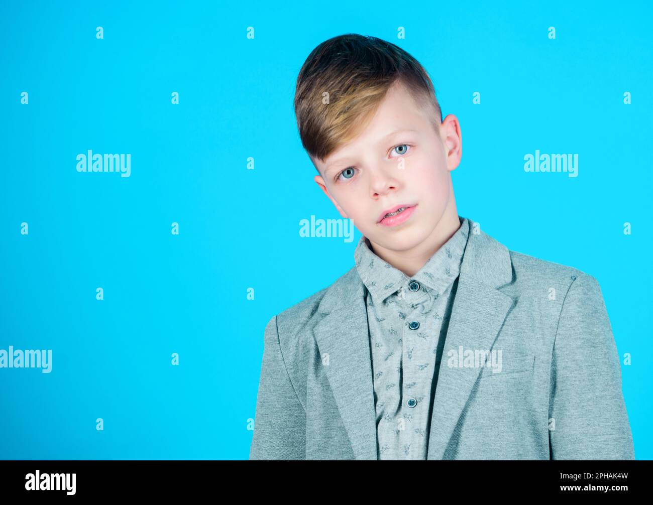 Trendy kid. Adorable fashion model. Fashion little boy with serious ...