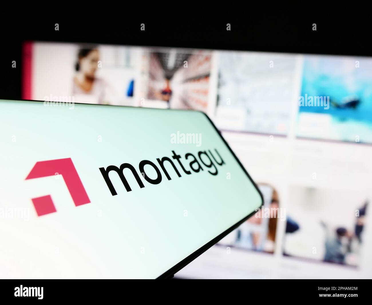 Mobile phone with logo of investment company Montagu Private Equity LLP ...