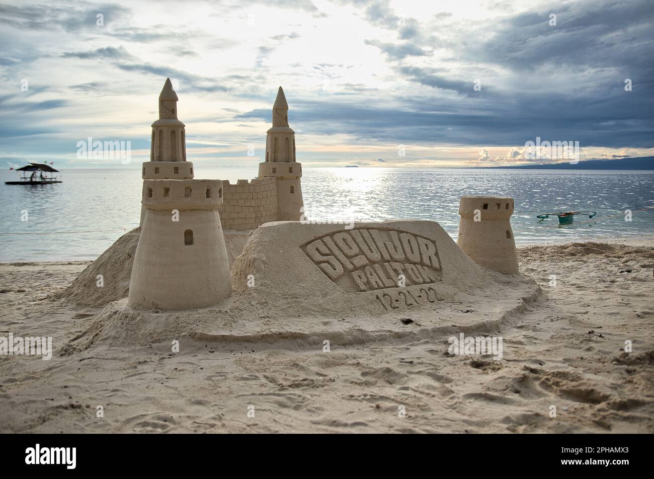 A detailed sand castle on the dreamlike idyllic beach of Siquijor in ...