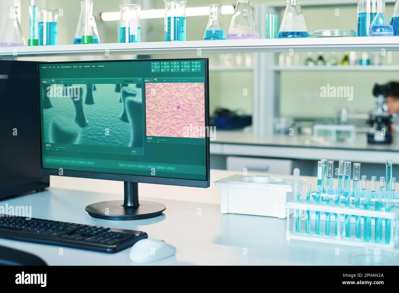 Workplace of modern clinician with computer screen and group of test ...