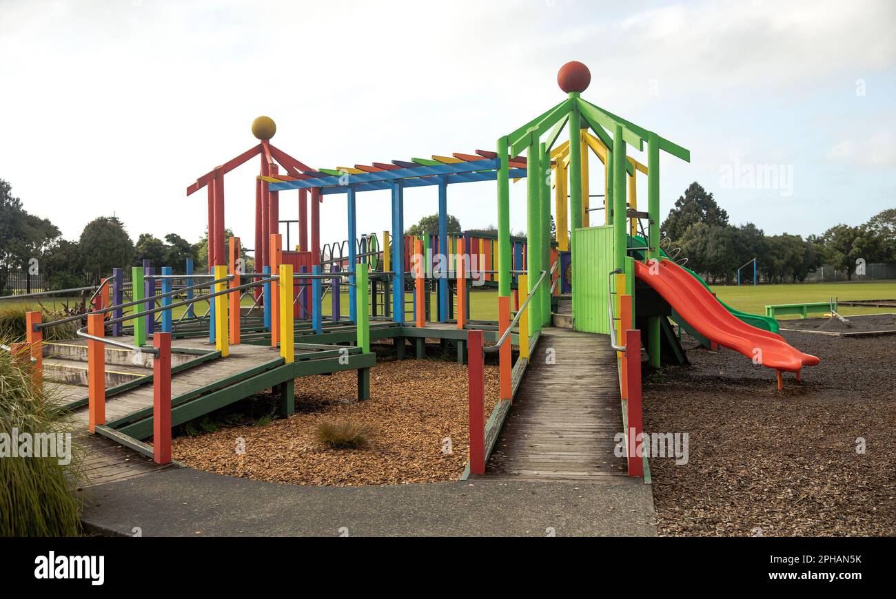 Colorful children's wooden playground structure Stock Photo - Alamy