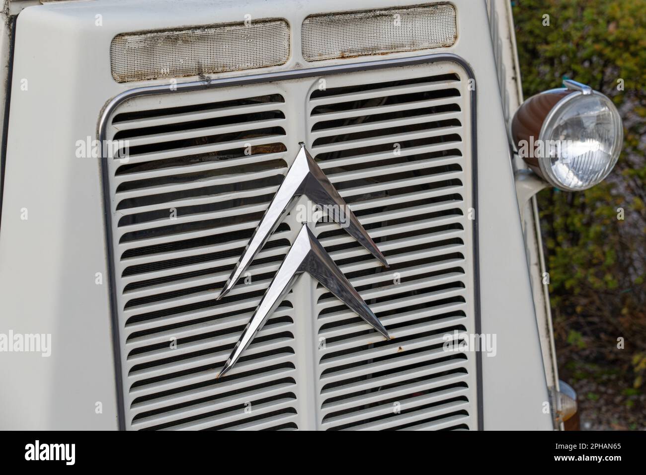 The headlight of an old Citroen H-type corrugated iron panel van Stock ...