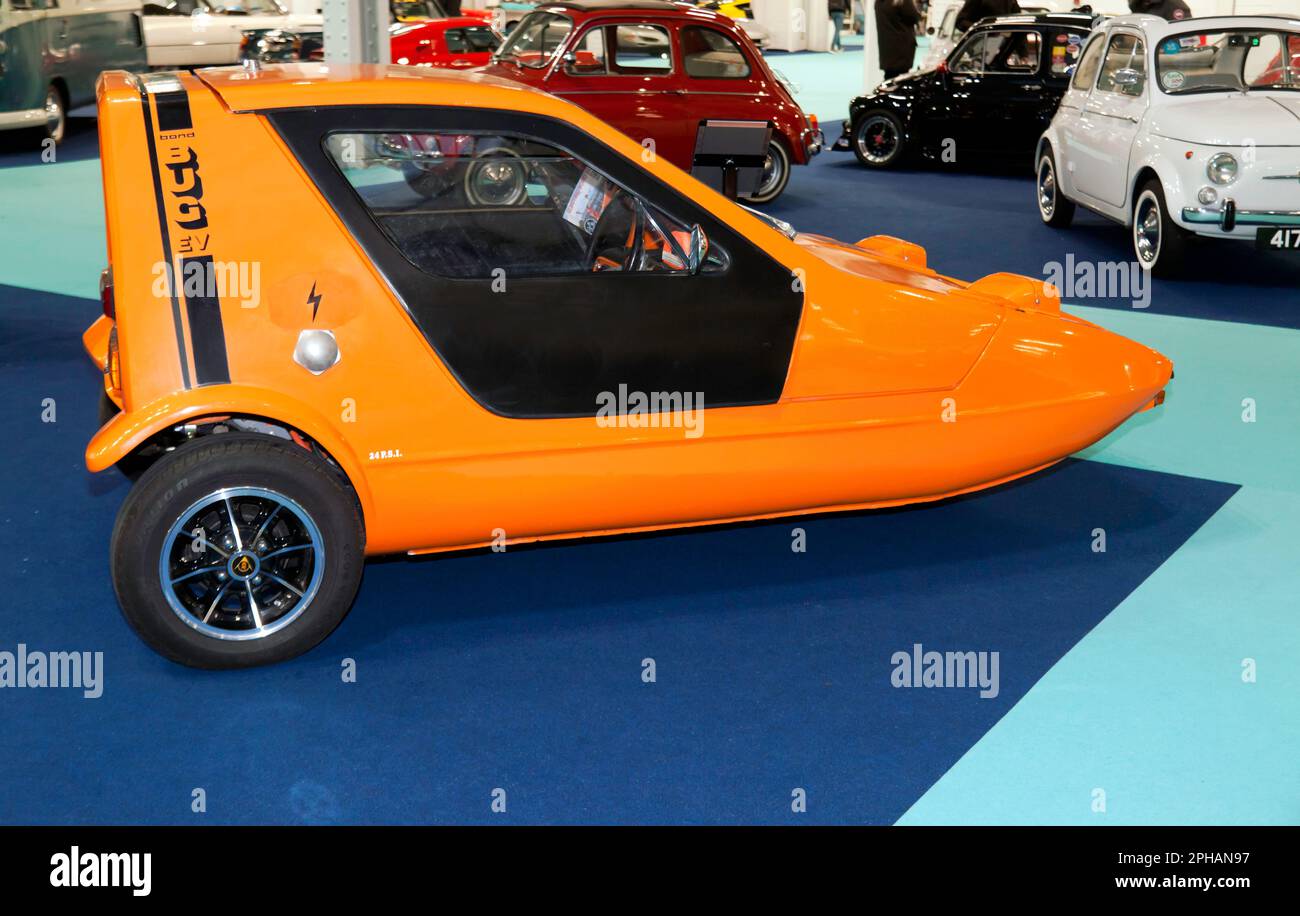 Side view of an Orange Bond Bug, converted into an EV, on display at ...