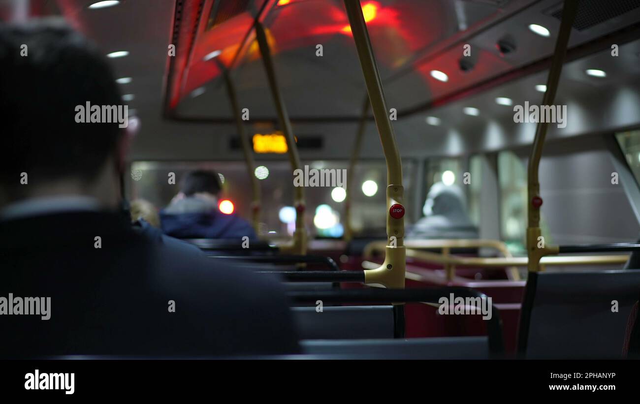 Back of bus interior at night in movement. Inside British public ...