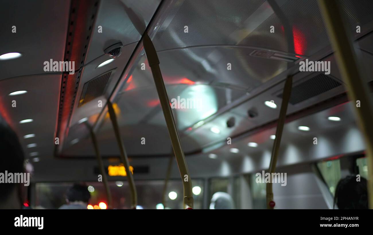 Back of bus interior at night in movement. Inside British public ...
