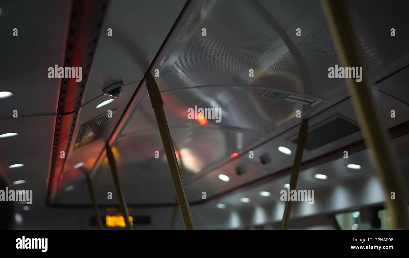 Back of bus interior at night in movement. Inside British public ...