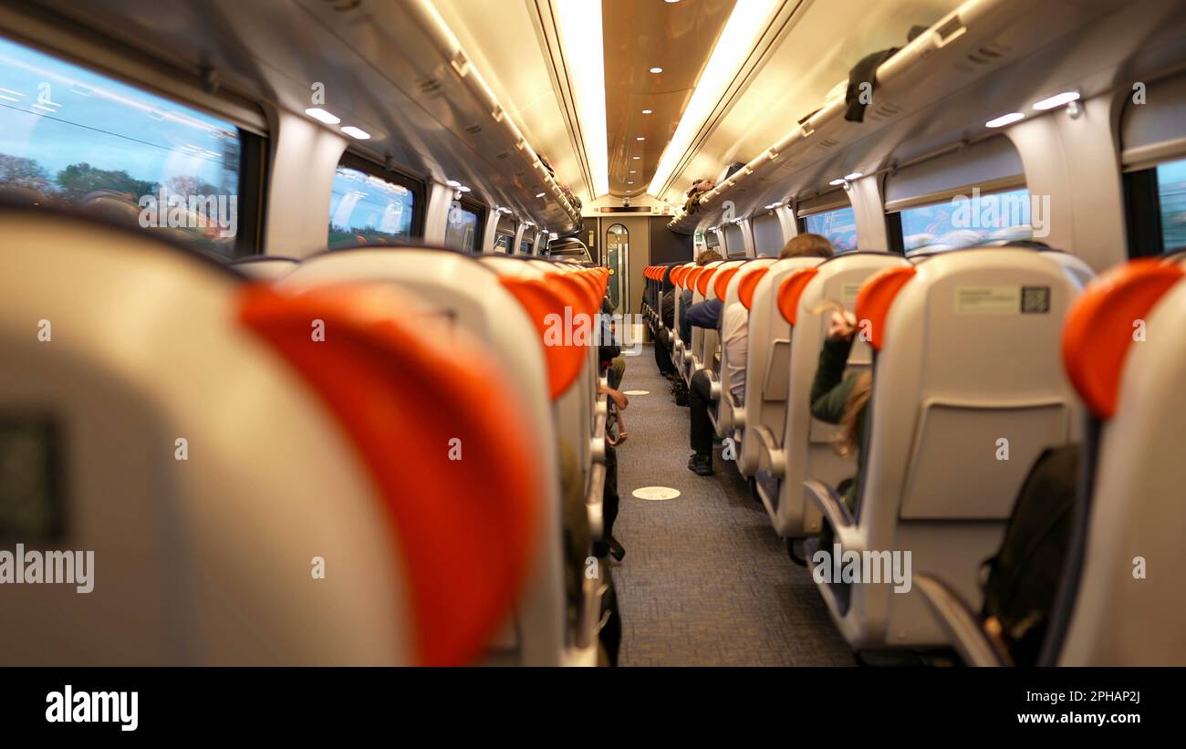 Back of train perspective interior highspeed transportation corridor ...