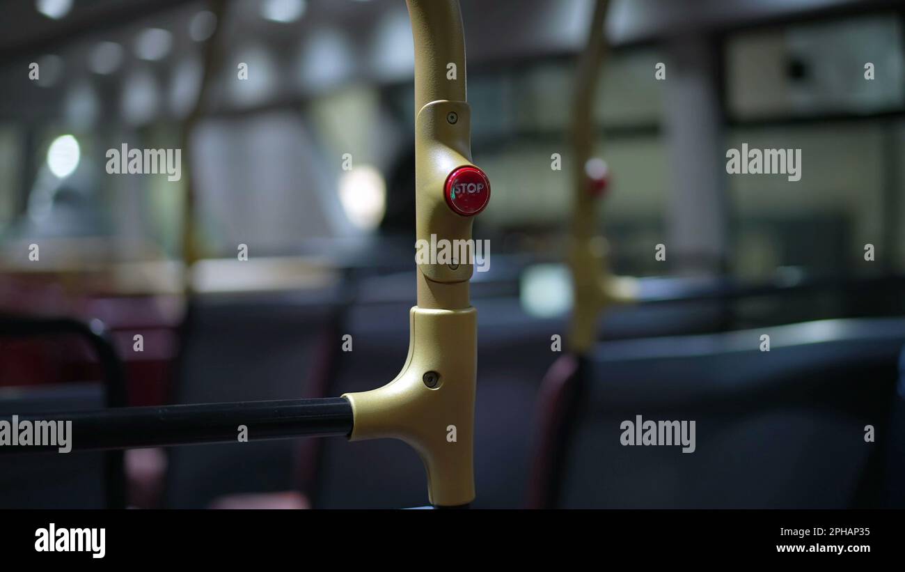 Closeup Stop button inside British bus interior of public ...