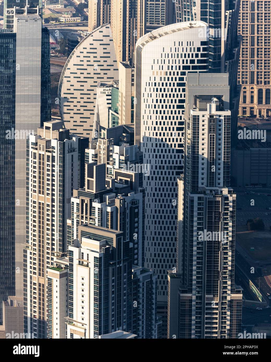 An aerial shot of bustling modern cityscape featuring multiple tall ...