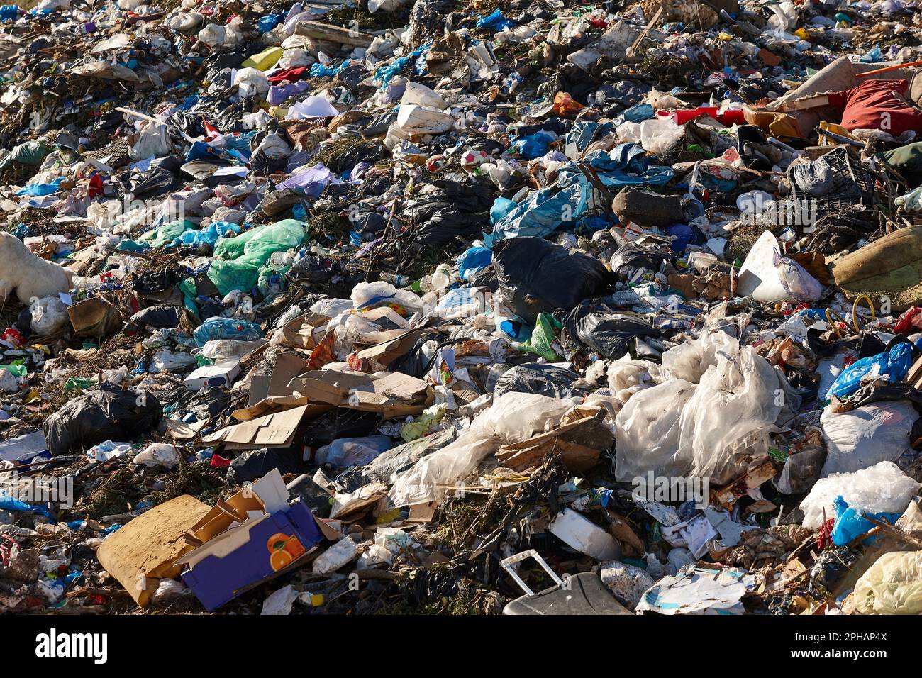 Open air garbage dump. Plastic pollution. Recycling junk. Consumerism ...