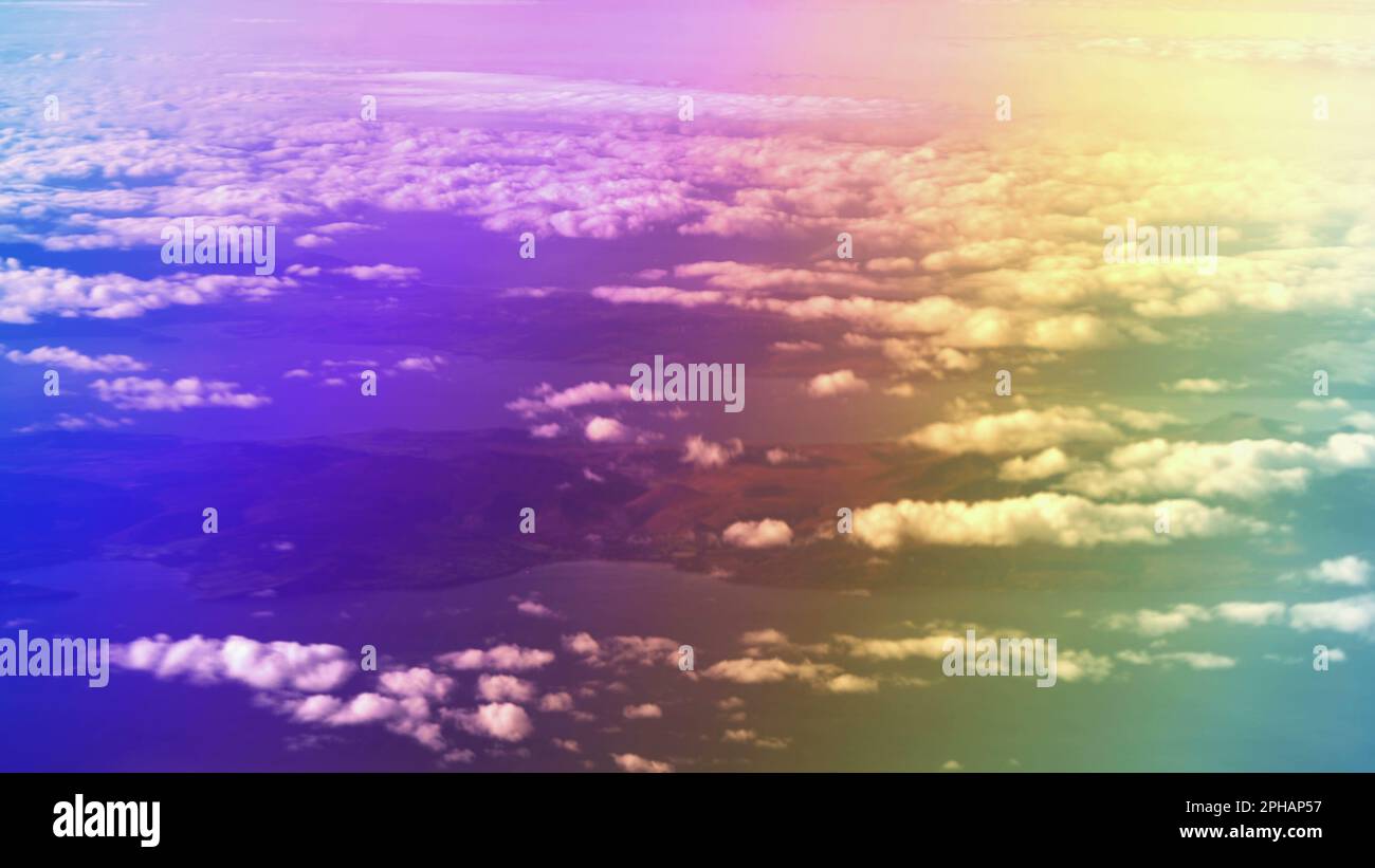 Flying in the air passenger window perspective looking at clouds and ...