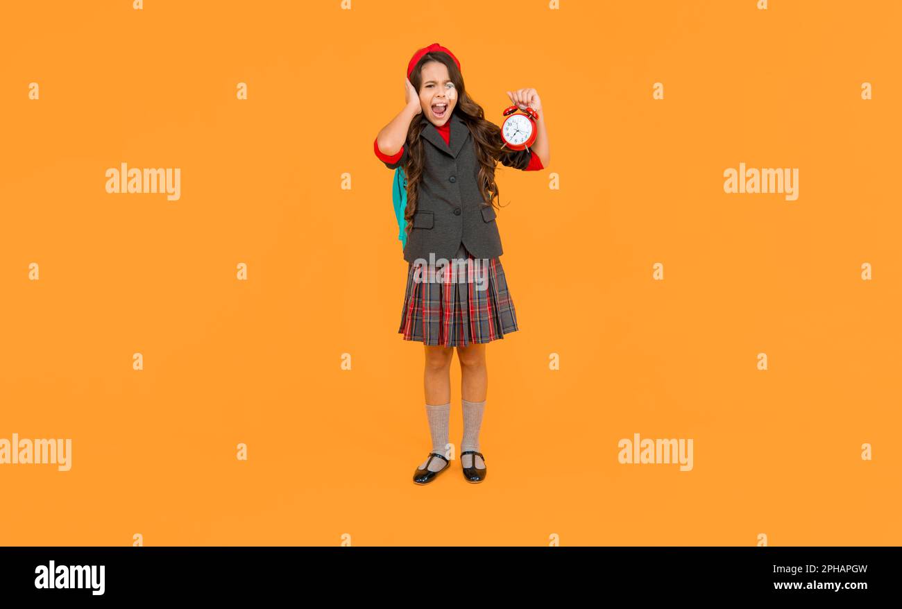 shouting child with loud alarm clock. teen girl carry backpack. back to ...