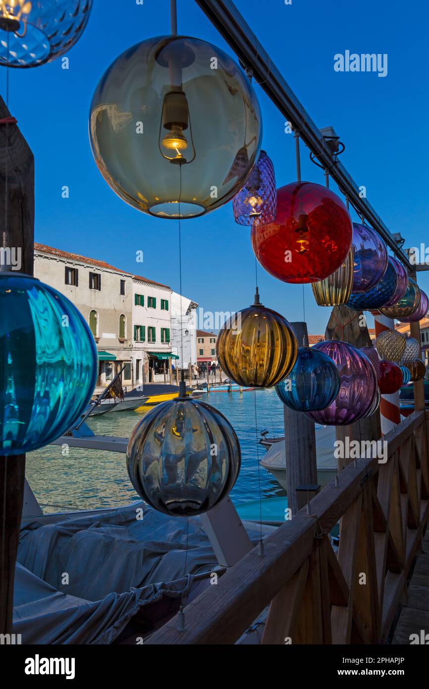 Murano glass lights with reflections hanging opposite Museo del Vetro Murano Glass Museum at ...