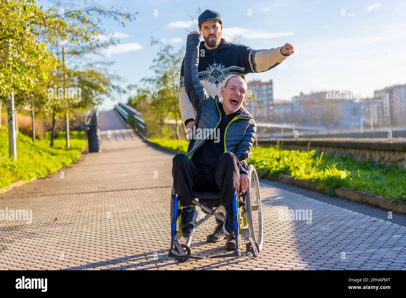 A disabled person in wheelchair with friend overjoyed, smiling ...