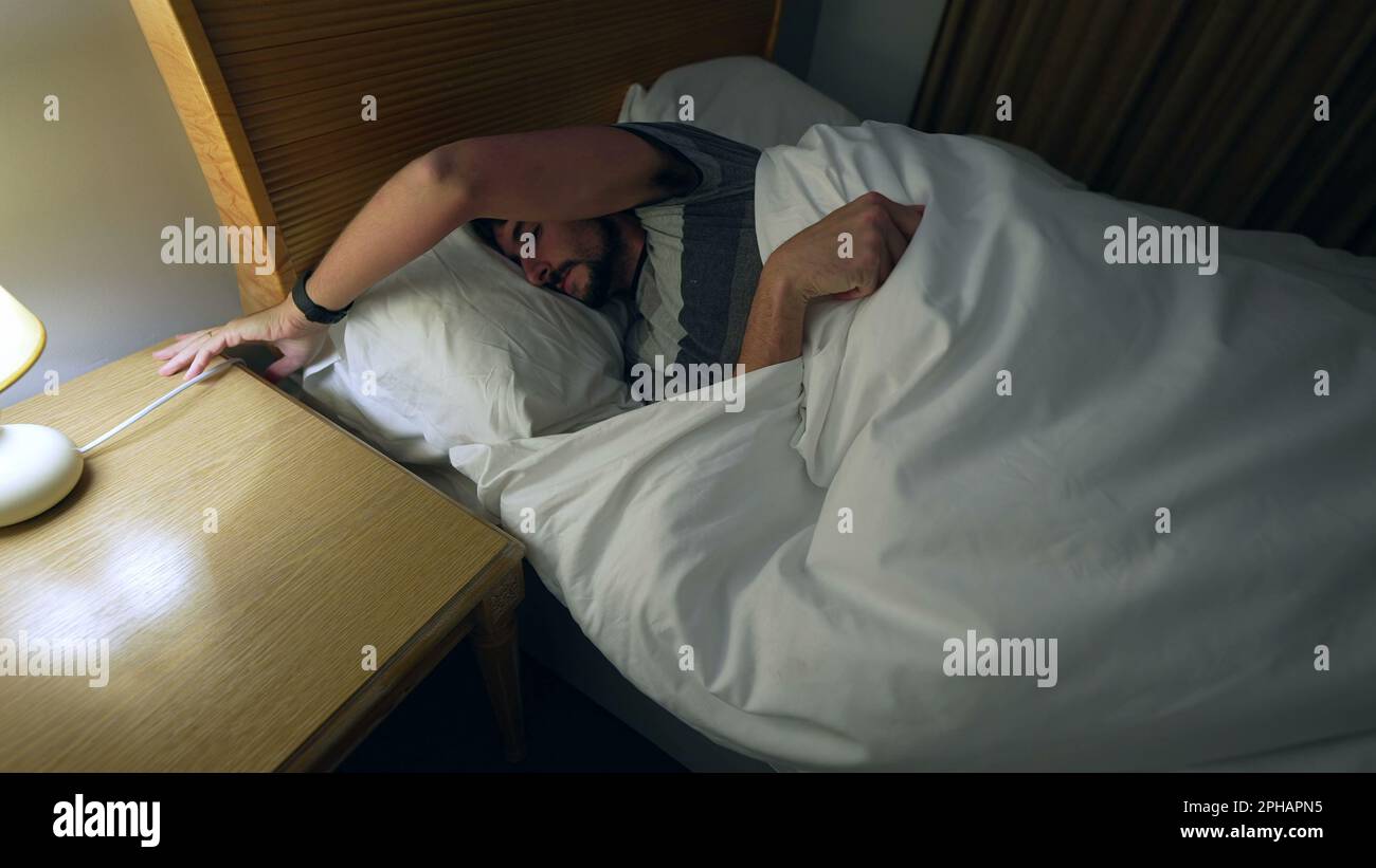 Turning off lamp bed hi-res stock photography and images - Alamy